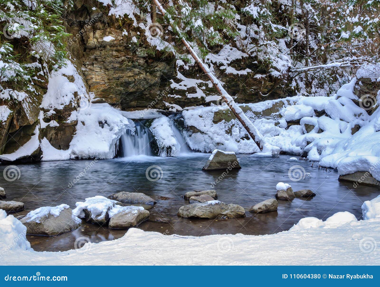Waterfall in Winter. Mountain River and Snow on the Mountain Slopes ...