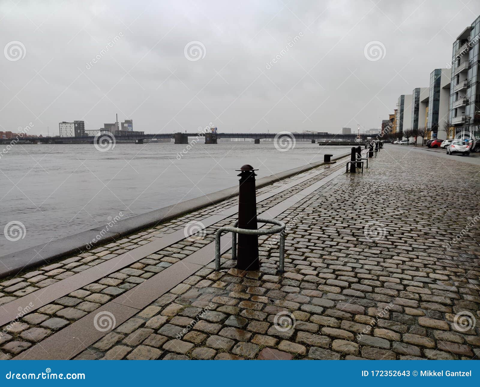 Waterfront with Buildings and Bridge in Background Stock Image - Image ...