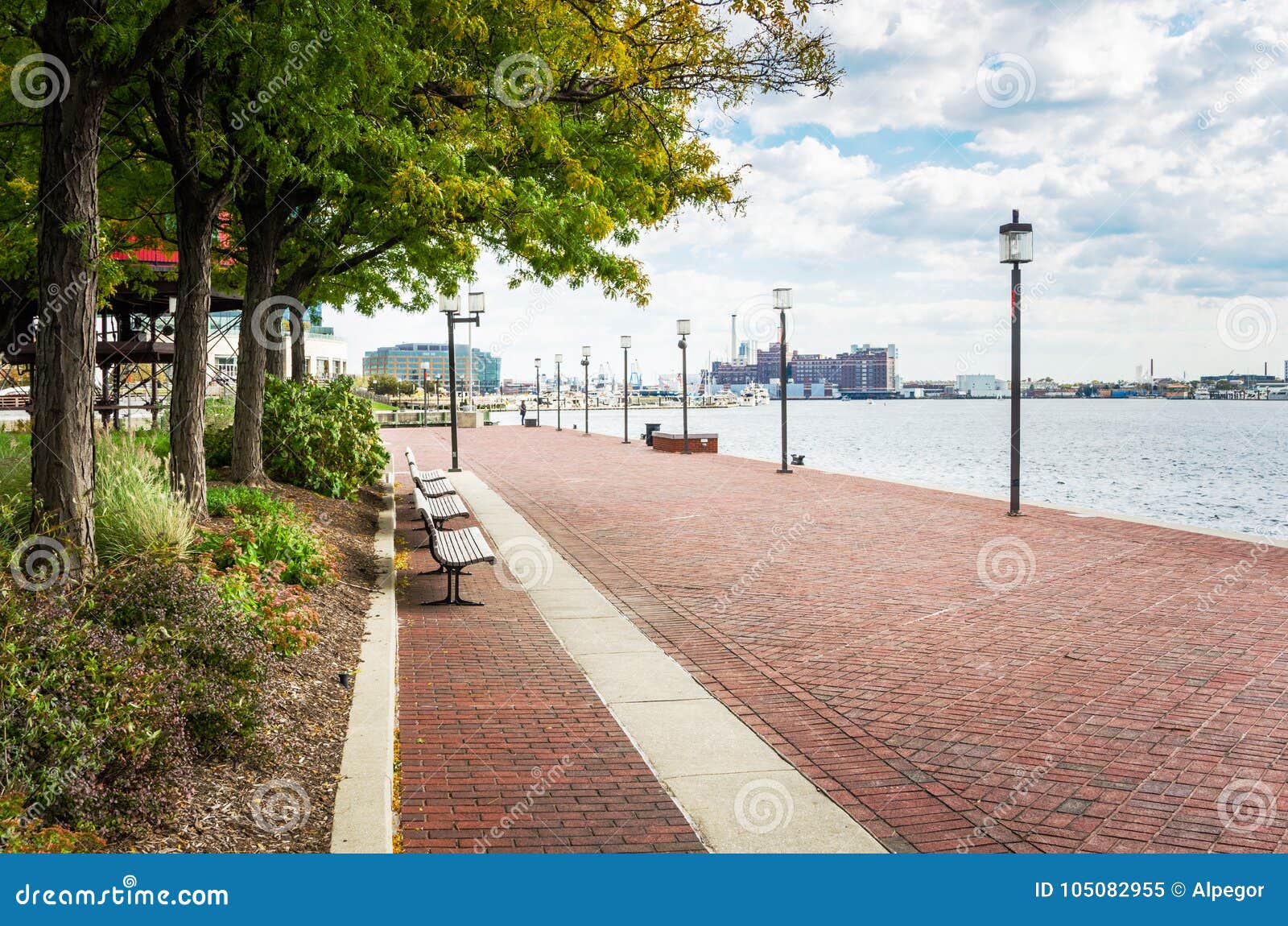 Waterfront Path Under a Cloudy Sky with Patches of Blue Stock Image ...