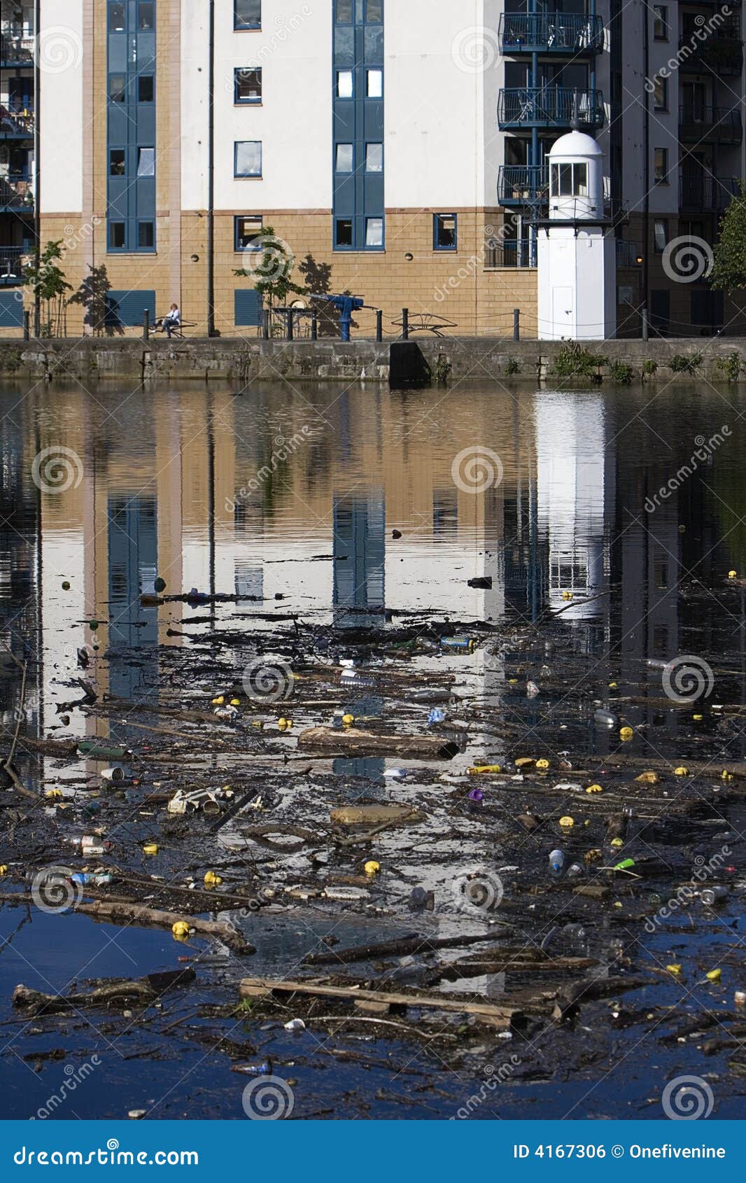 Waterfront Pollution and Lighthouse Stock Photo - Image of trees, waste ...