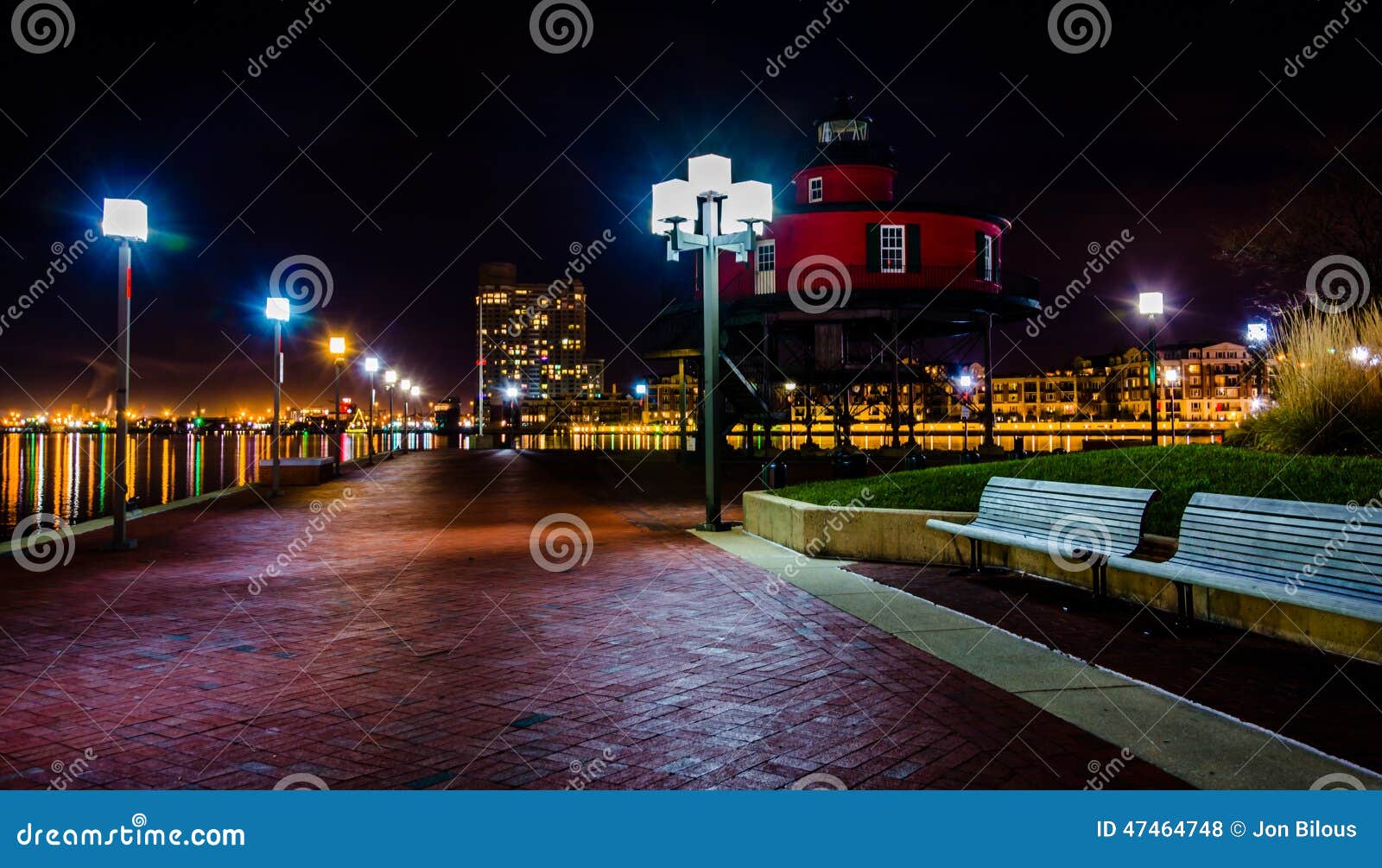 Waterfront Promenade and Lighthouse at Night in the Inner Harbor Stock ...