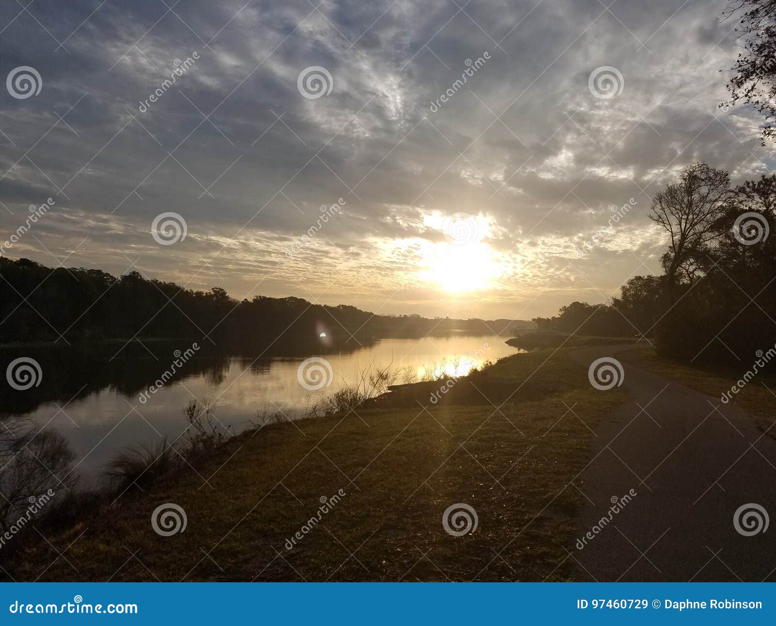 Waterfront sunrise stock image. Image of clouds, waterfront - 97460729