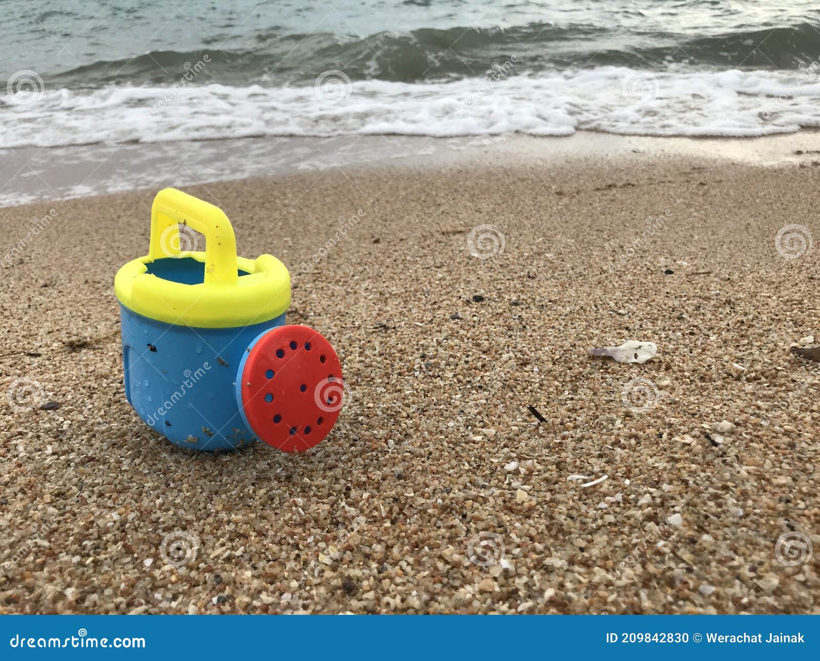 Watering Can Plastic on the Beach Stock Photo - Image of background ...