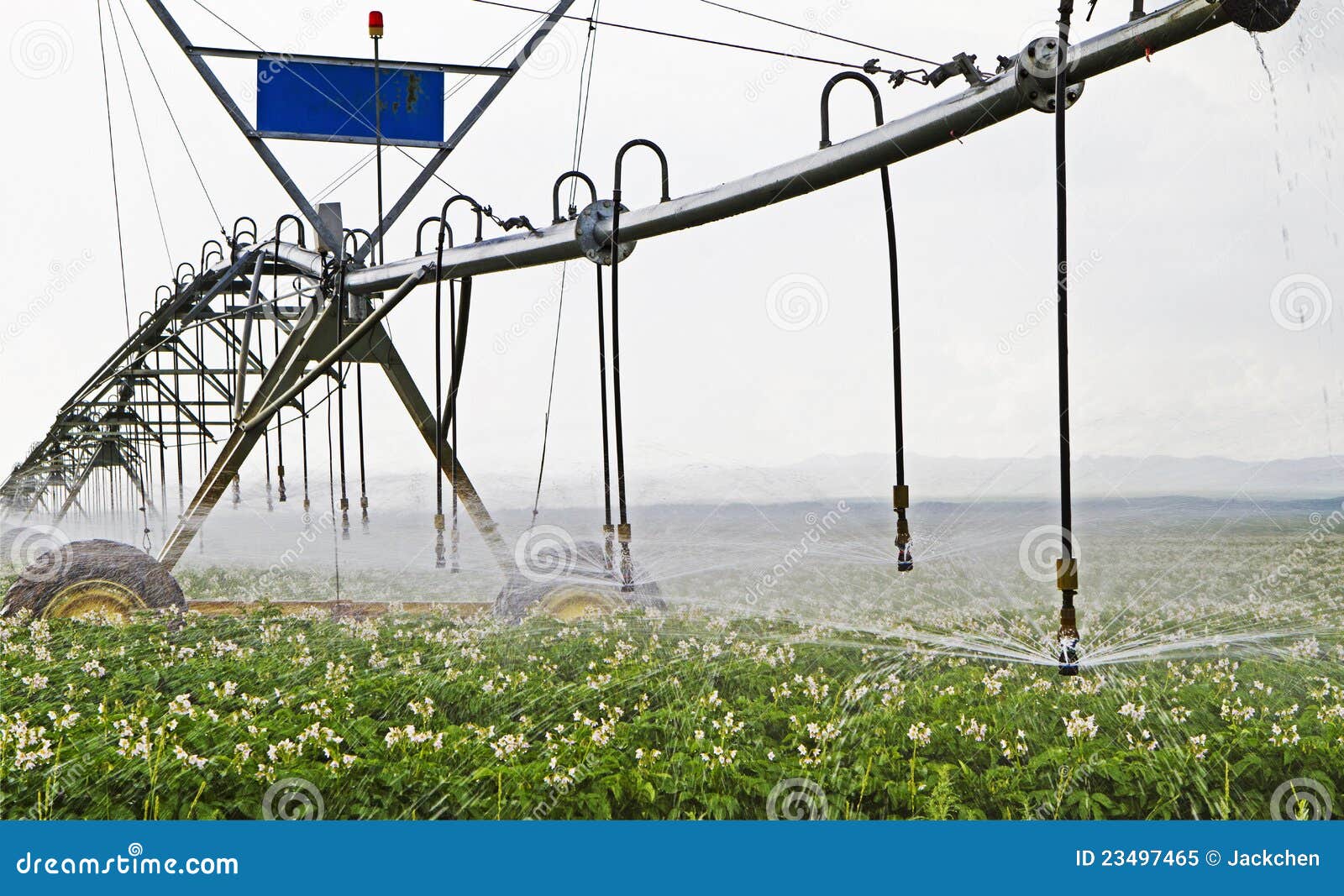 Watering the crops stock image. Image of grassland, farming - 23497465