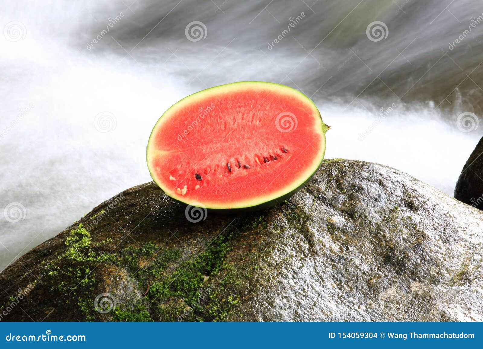Watermelonon on the Rocks in the River Stock Photo - Image of slice ...