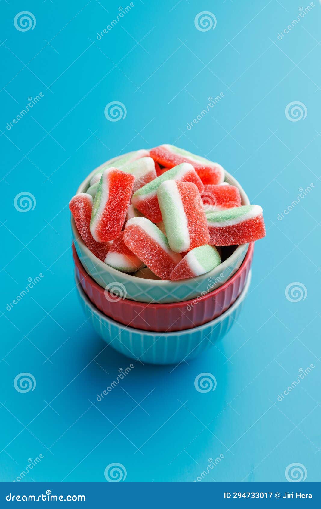 Watermelon Jelly Candies in Bowl on Blue Table Stock Image - Image of ...