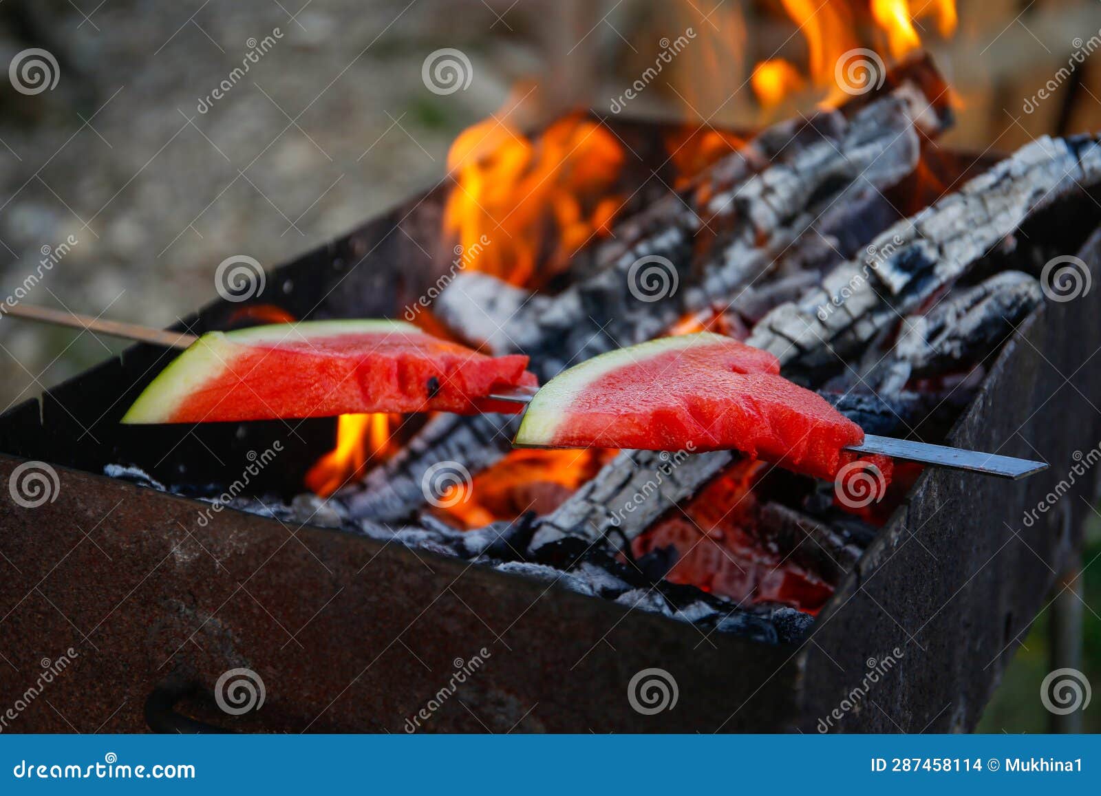 Watermelon on a Skewer is Fried on a Fire Stock Photo - Image of ...
