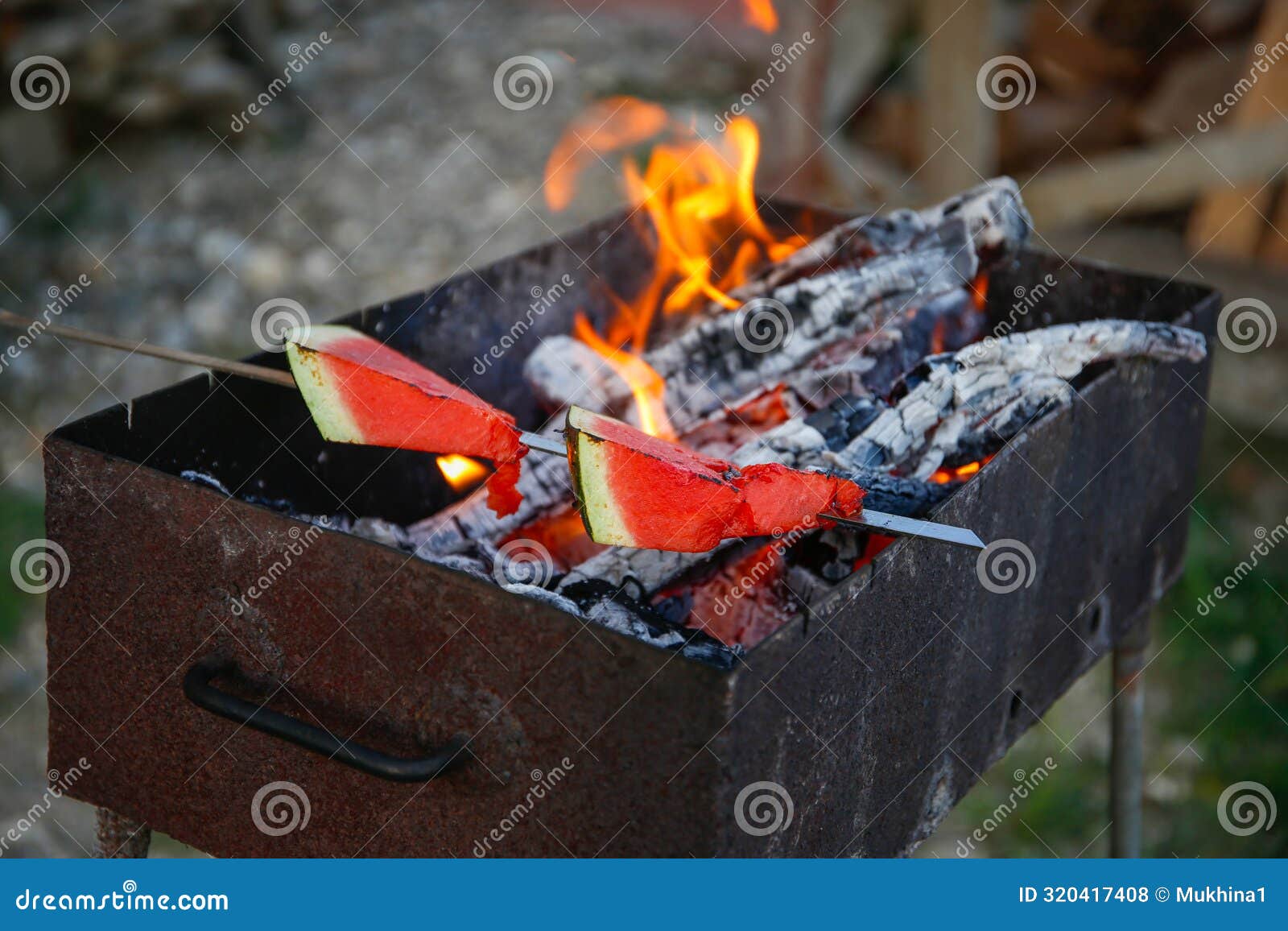 Watermelon on a Skewer is Fried on a Fire Stock Photo - Image of juicy ...