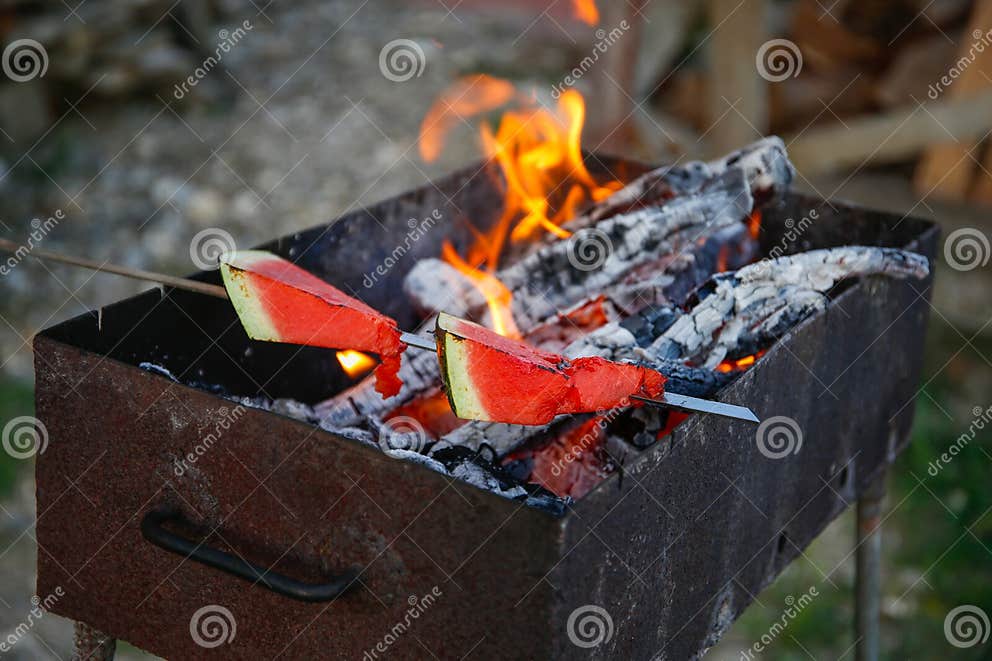 Watermelon on a Skewer is Fried on a Fire Stock Photo - Image of juicy ...