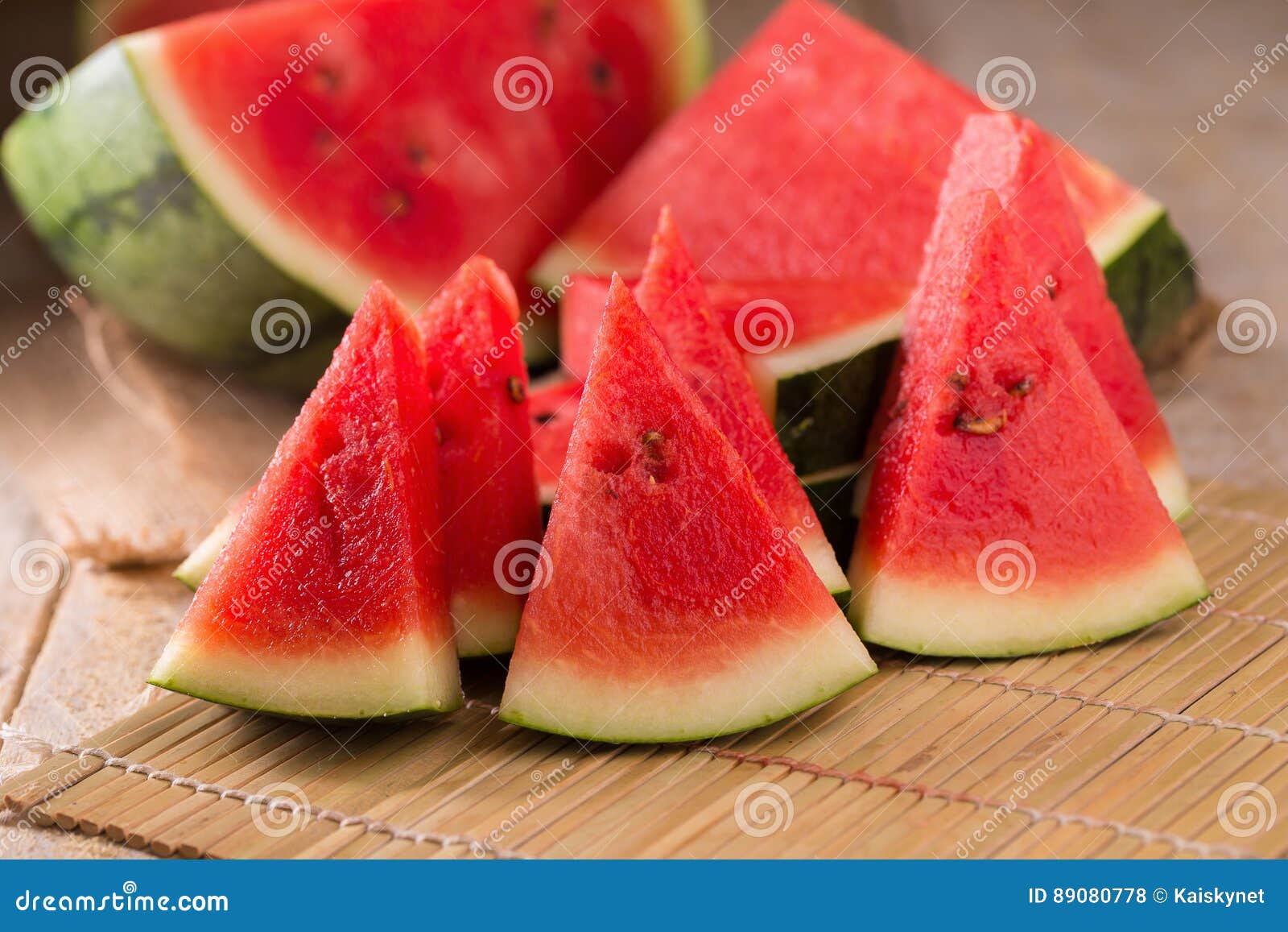 Watermelon and Watermelon Pieces in a Wooden Background Stock Photo ...