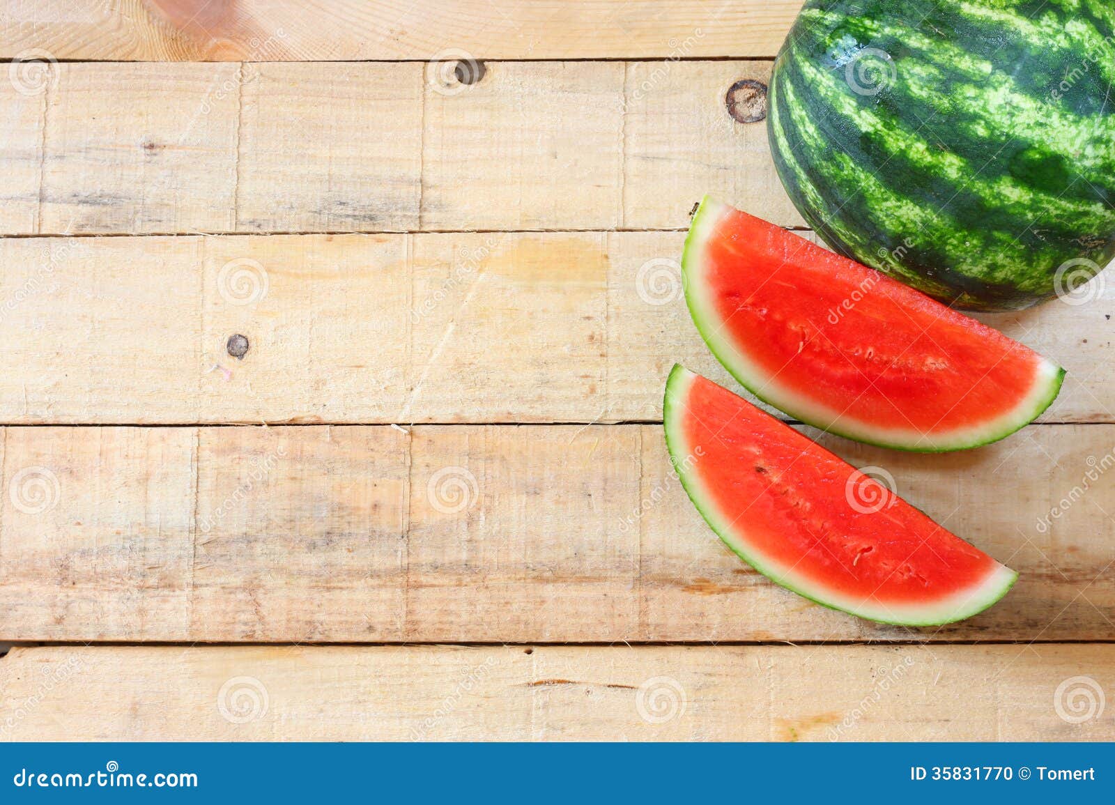 Watermelon on wooden table stock photo. Image of deck - 35831770