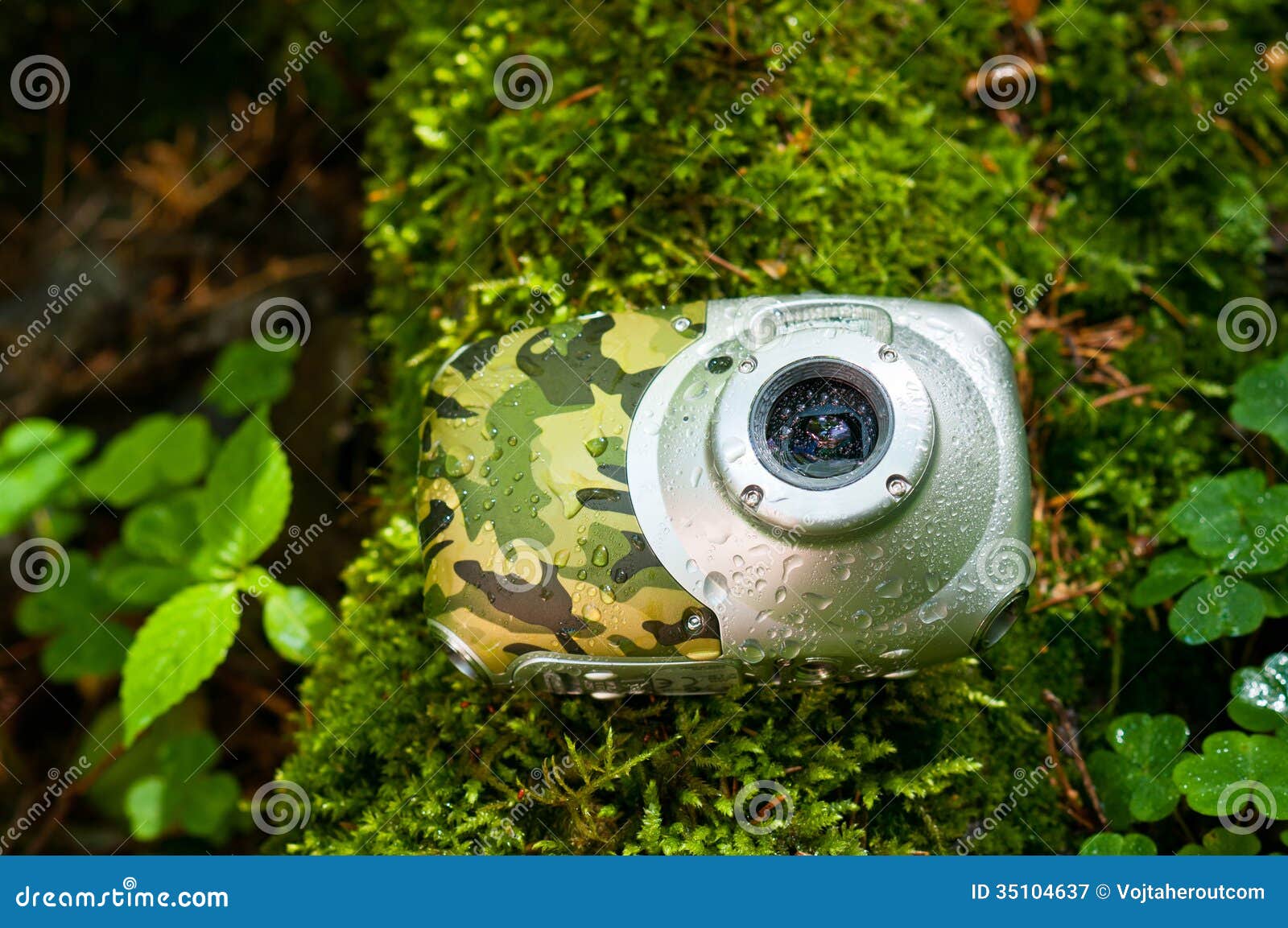 Waterproof Compact Camera Covered with Water Drops Lying on the Forest ...