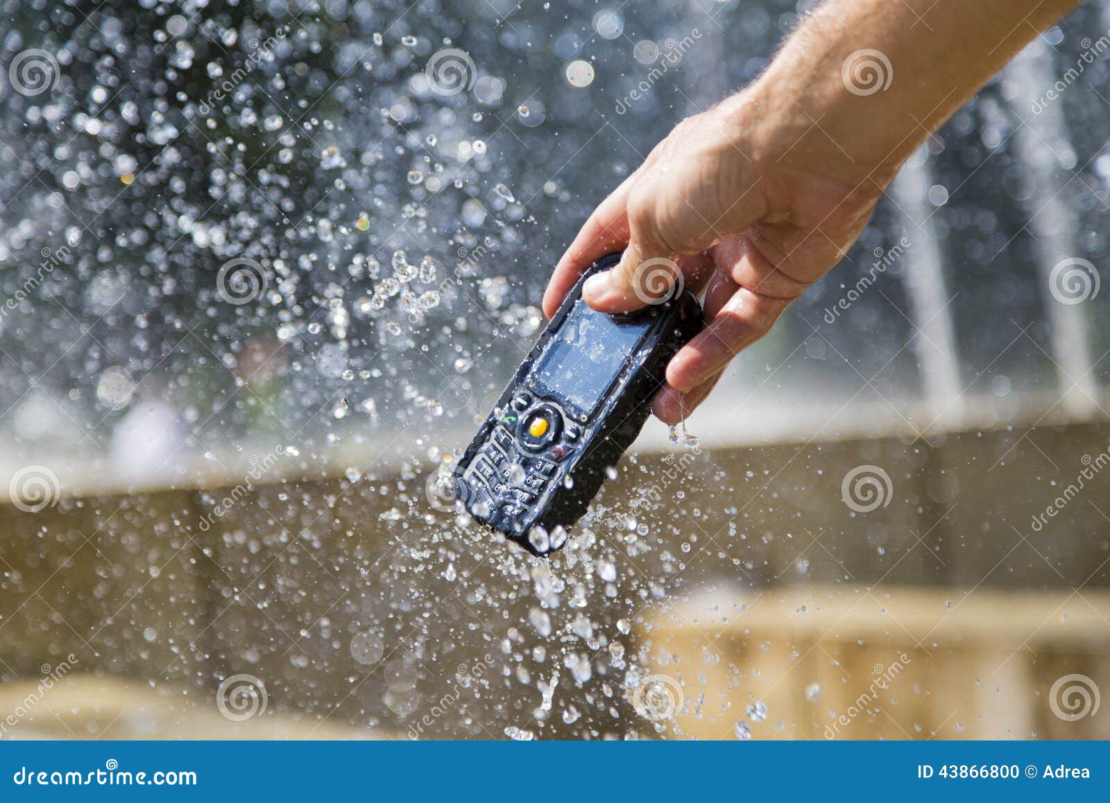 Testing a Rugged Mobile Phone Stock Photo - Image of spray, holiday ...