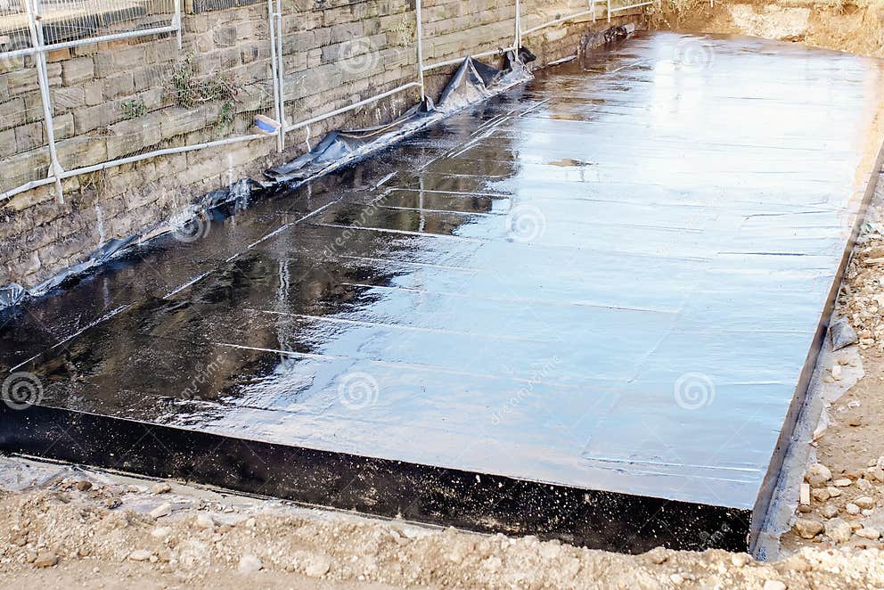 Waterproofing Coating. Builder Applying Waterproofing Bitumen Mastic on Concrete Stock Photo ...