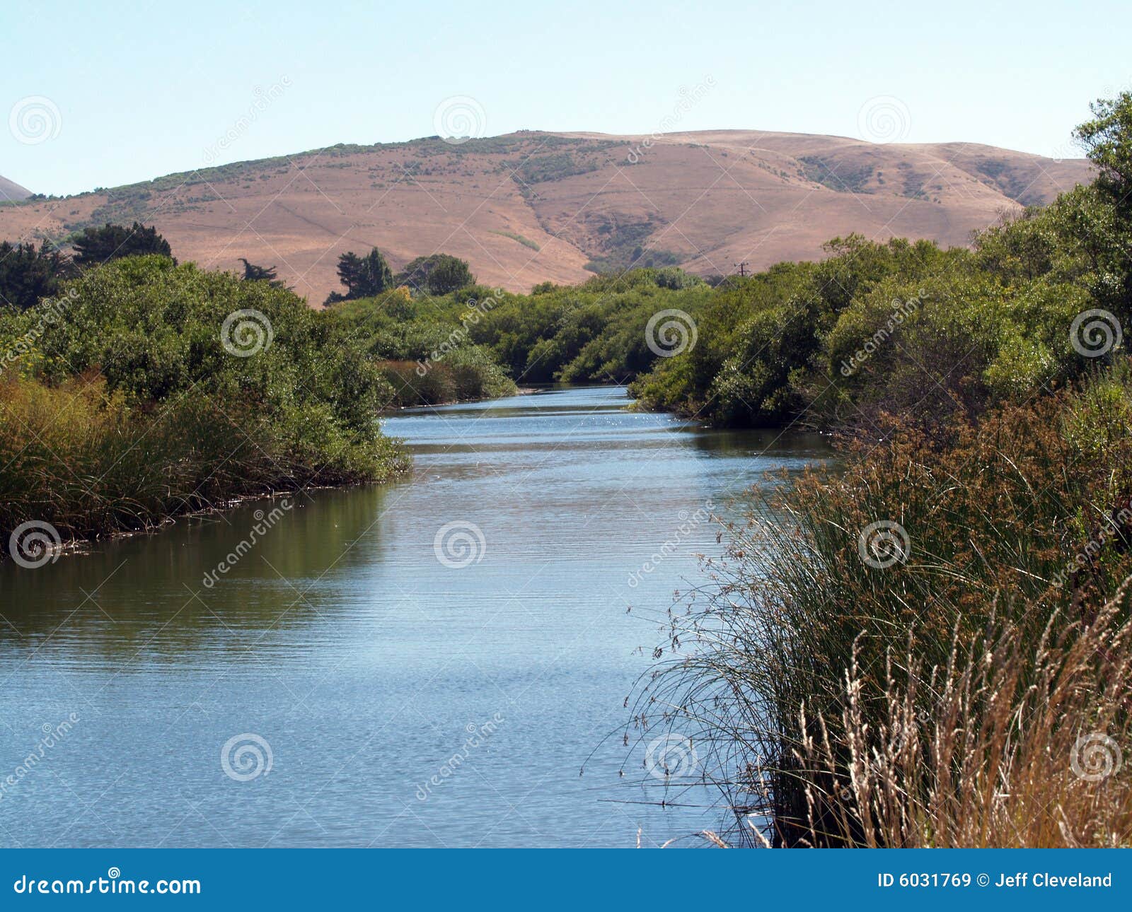 Waterway slough with hills stock image. Image of blue - 6031769