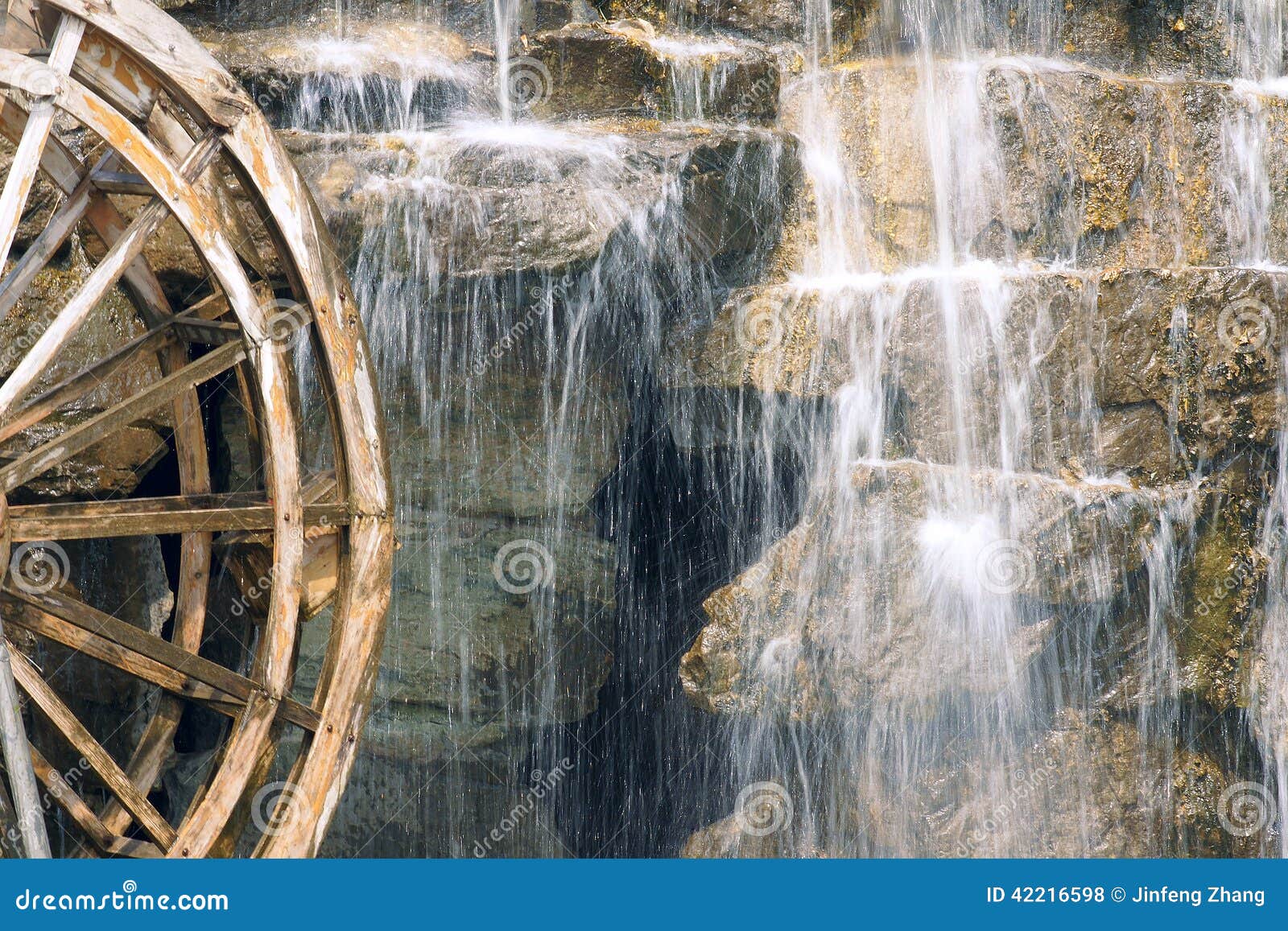 Waterwheel and waterfall stock photo. Image of stream - 42216598