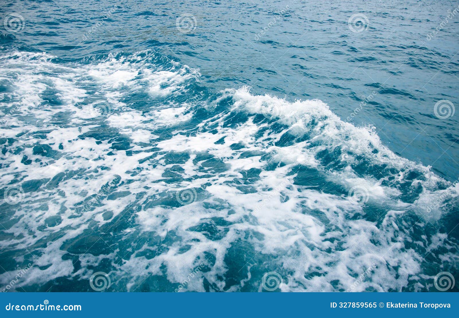 Wave on Blue Water and White Foam on the Tops of the Waves from Under ...