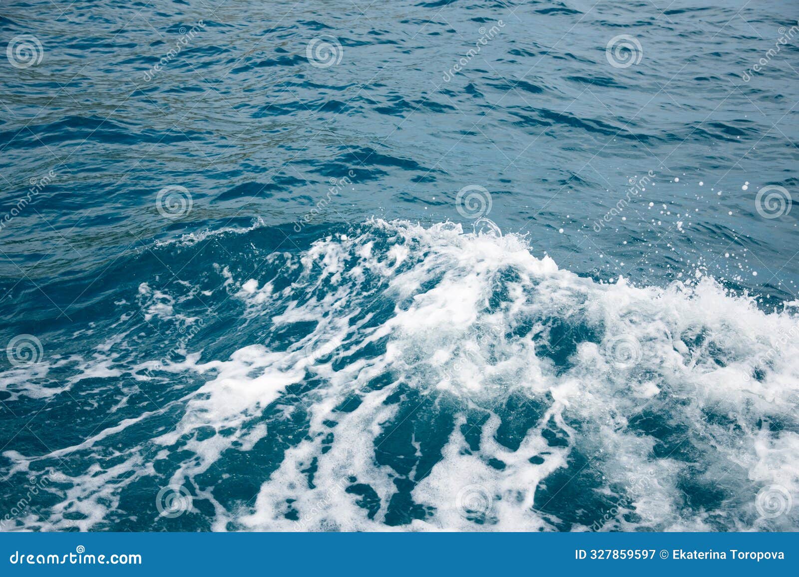 Wave on Blue Water and White Foam on the Tops of the Waves from Under ...