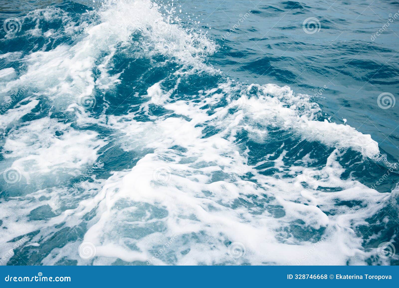 Wave on Blue Water and White Foam on the Tops of the Waves from Under ...