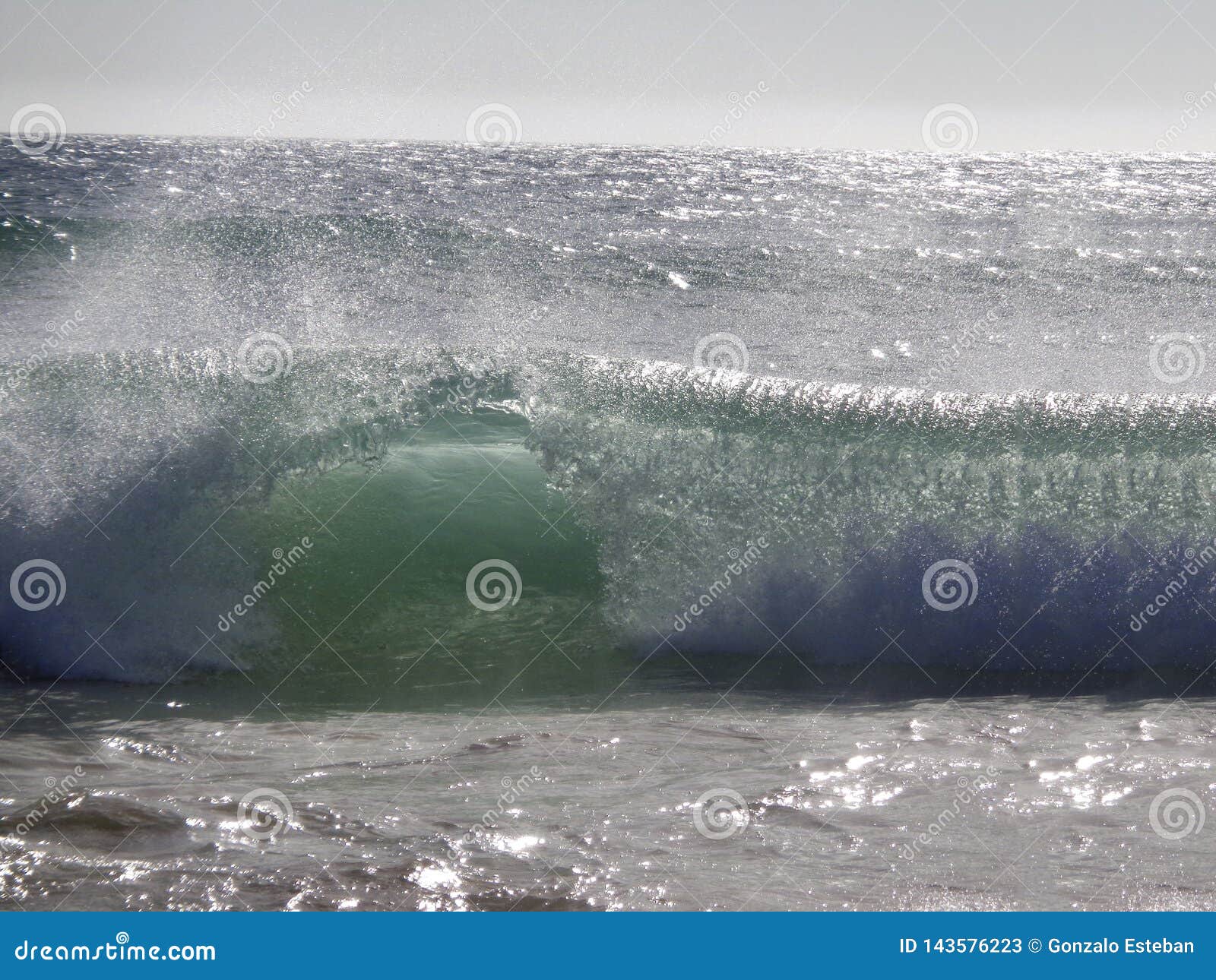 Wave breaking on the beach stock image. Image of beach - 143576223