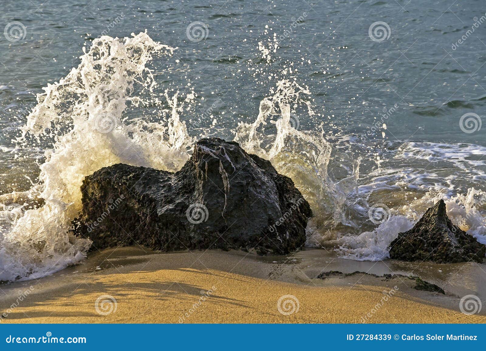 Wave breaking on a rock stock image. Image of abstract - 27284339