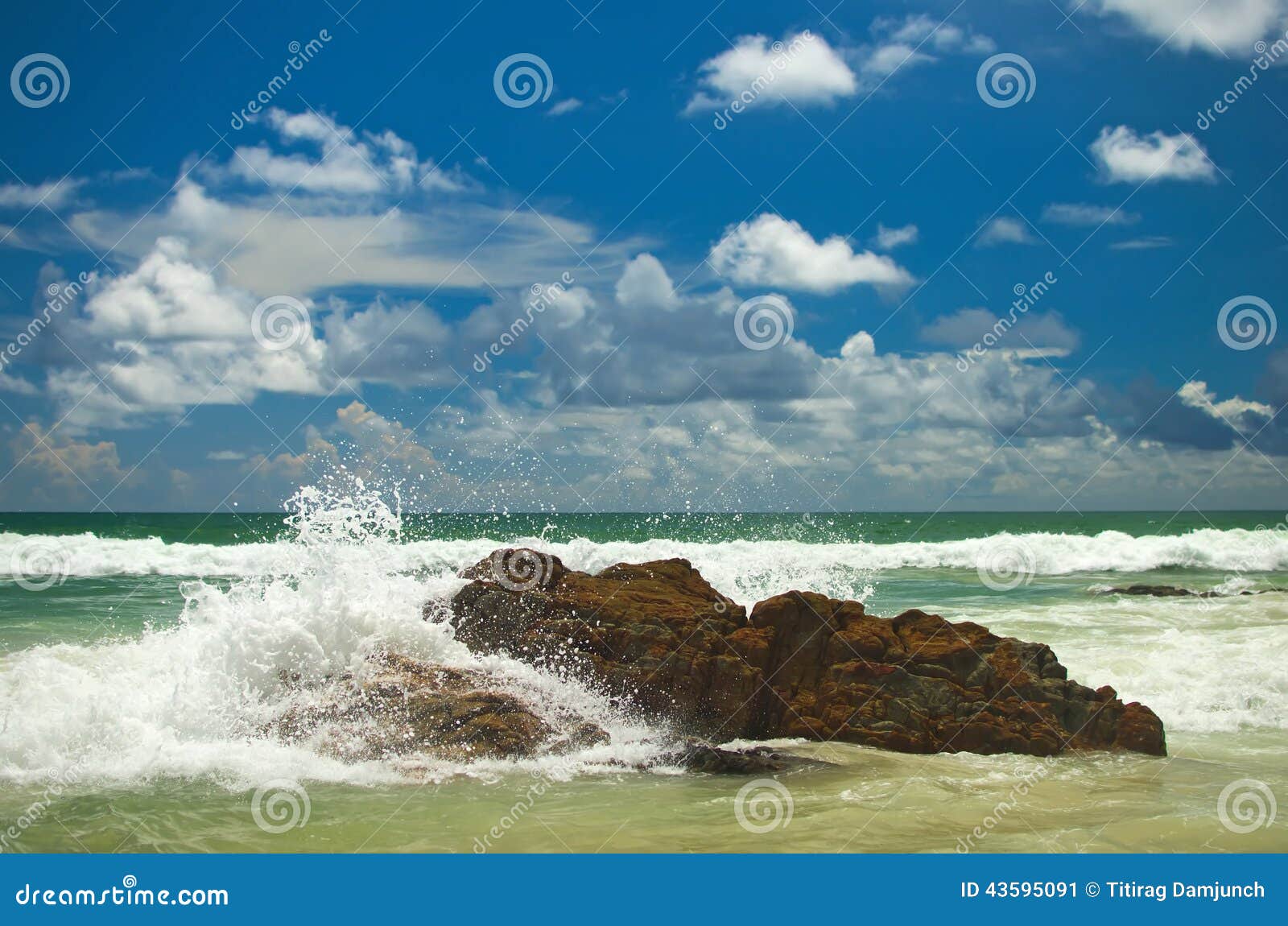 The Wave are Breaking from the Rock on the Beach with Blue Sky and ...