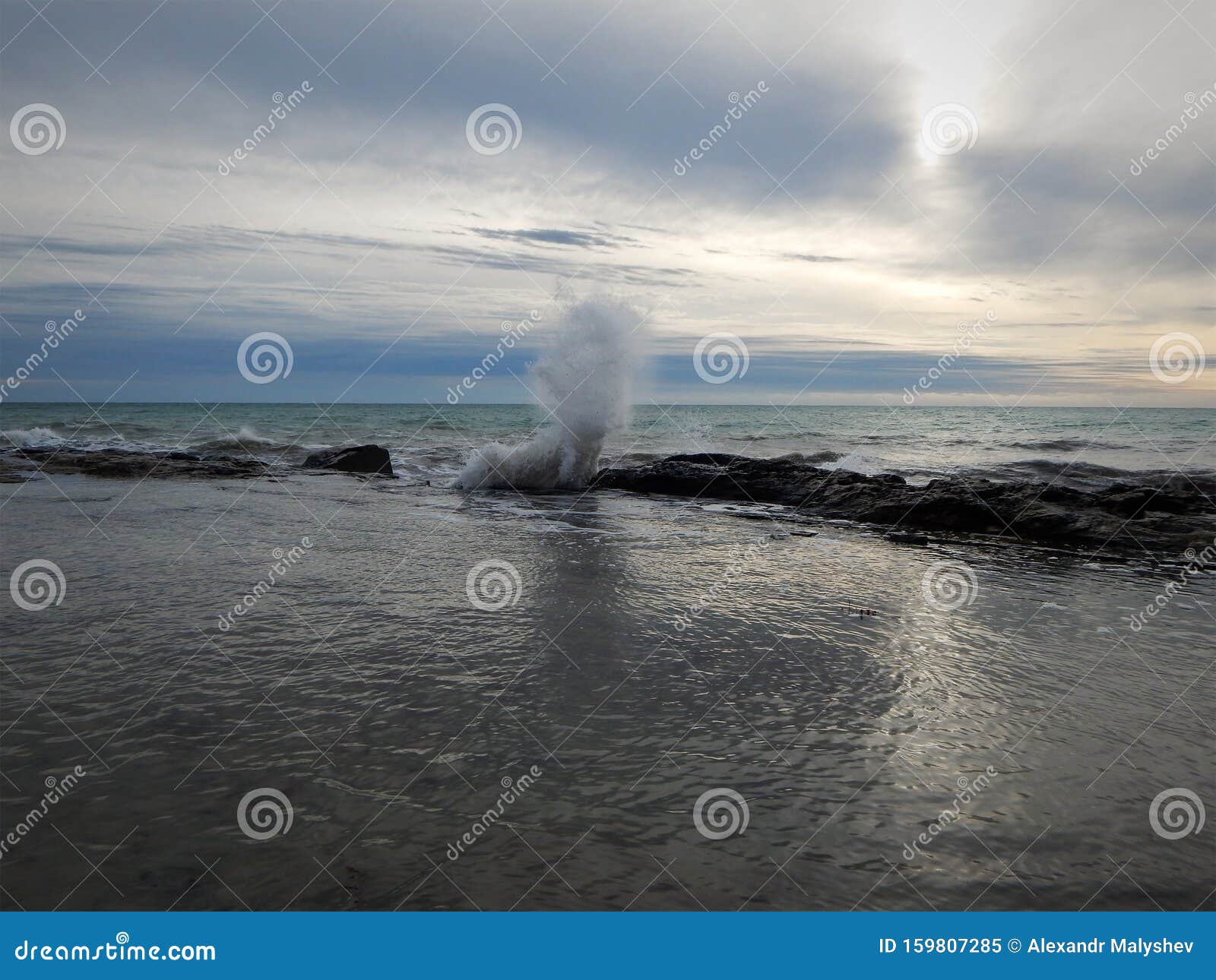 Wave breaks on the rocks stock image. Image of force - 159807285