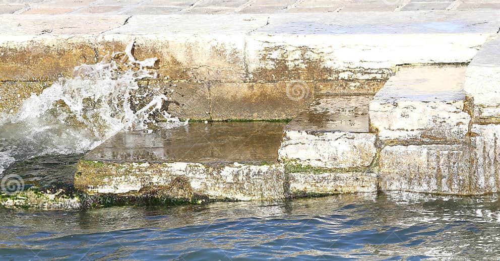Wave of a Canal Slamming on Steps Stock Image - Image of canal ...