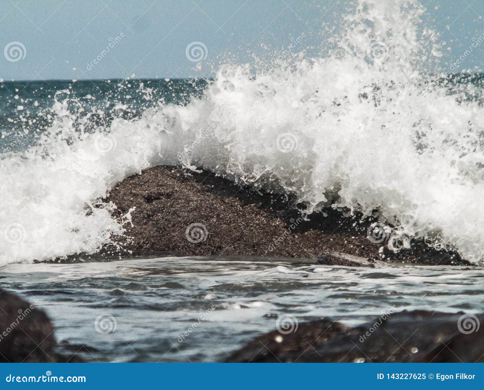 Wave crash stock image. Image of waterdrop, stone, water - 143227625
