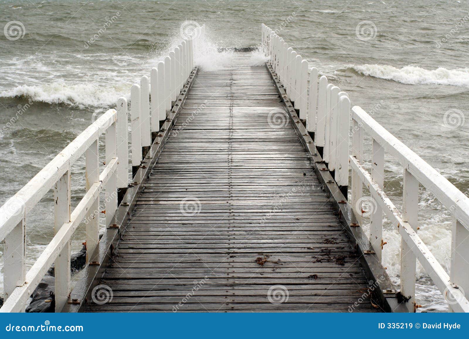 Wave crashes along a jetty stock image. Image of damp, fishing - 335219