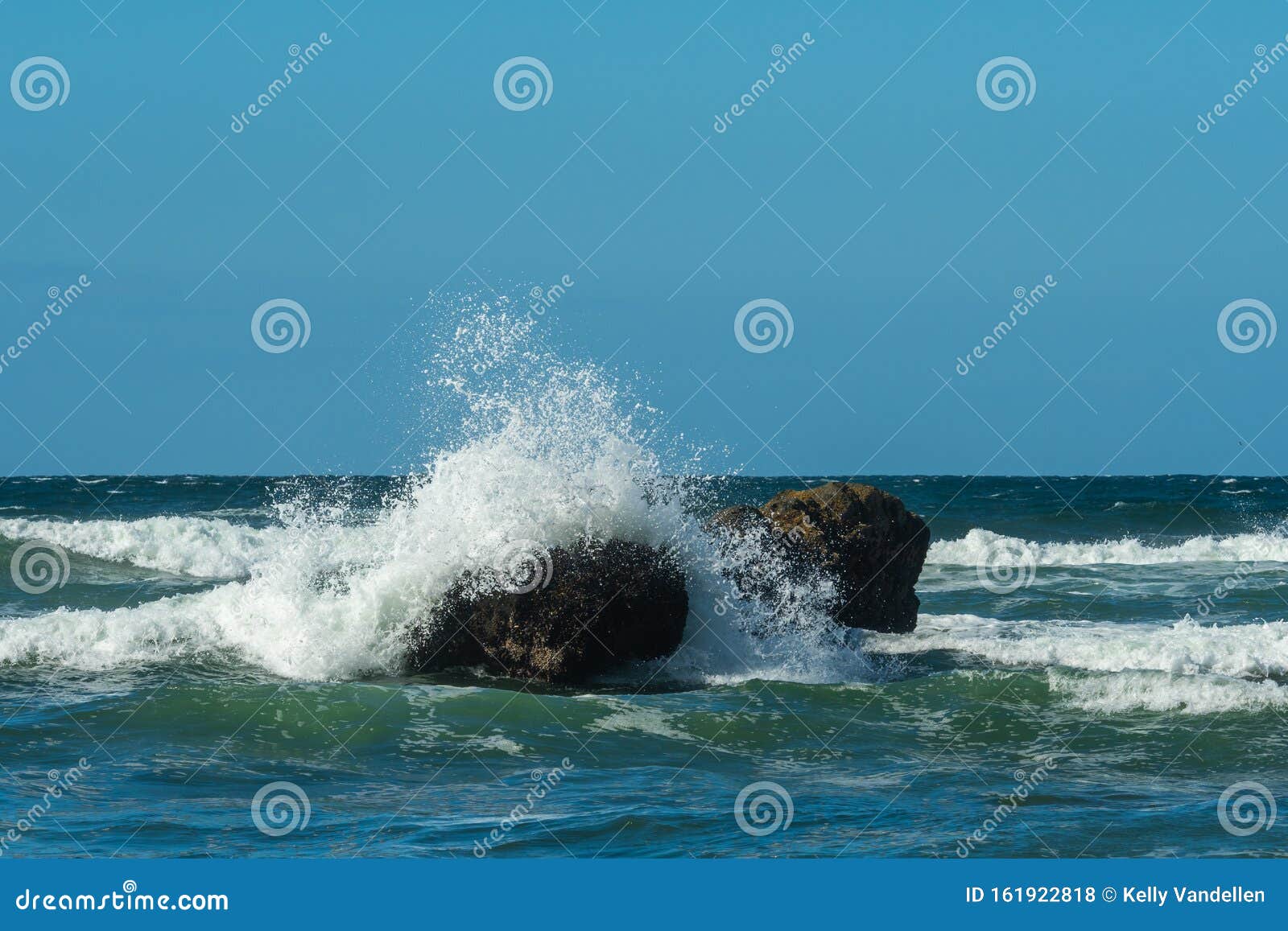 Wave Crashes into Boulders in Pacific Stock Photo - Image of splash ...