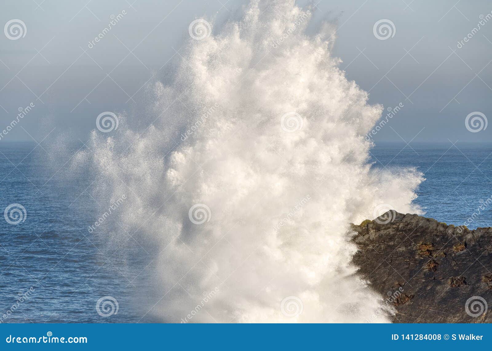 Wave Crashes Onto Rock, Exploding Upwards and Outwards. Stock Photo ...