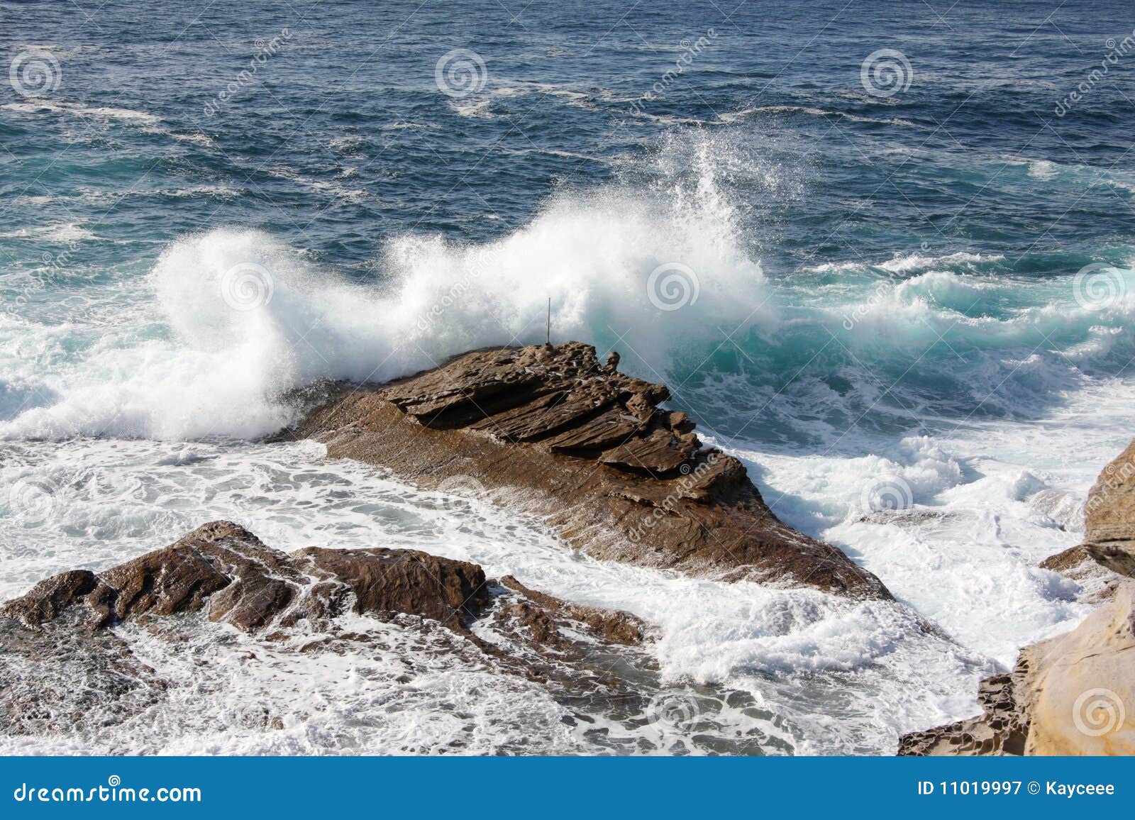 Wave crashes over rocks stock image. Image of foam, coastline - 11019997