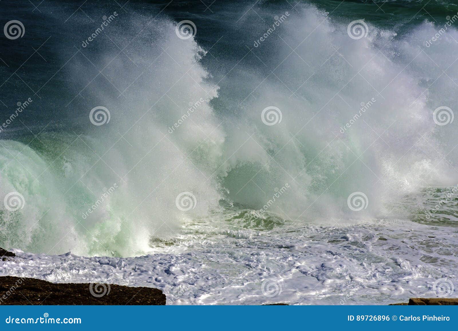 Wave Crashing Against Rocks on the Beach Stock Photo - Image of scenic ...
