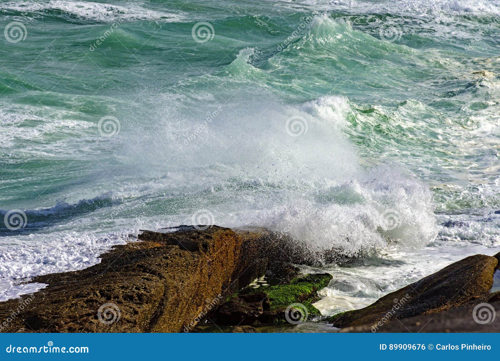 Wave Crashing Against Rocks Stock Photo - Image of shore, crashing ...