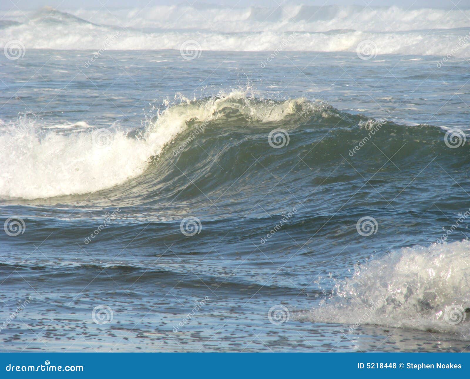 Wave crashing onto shore stock photo. Image of inviting - 5218448