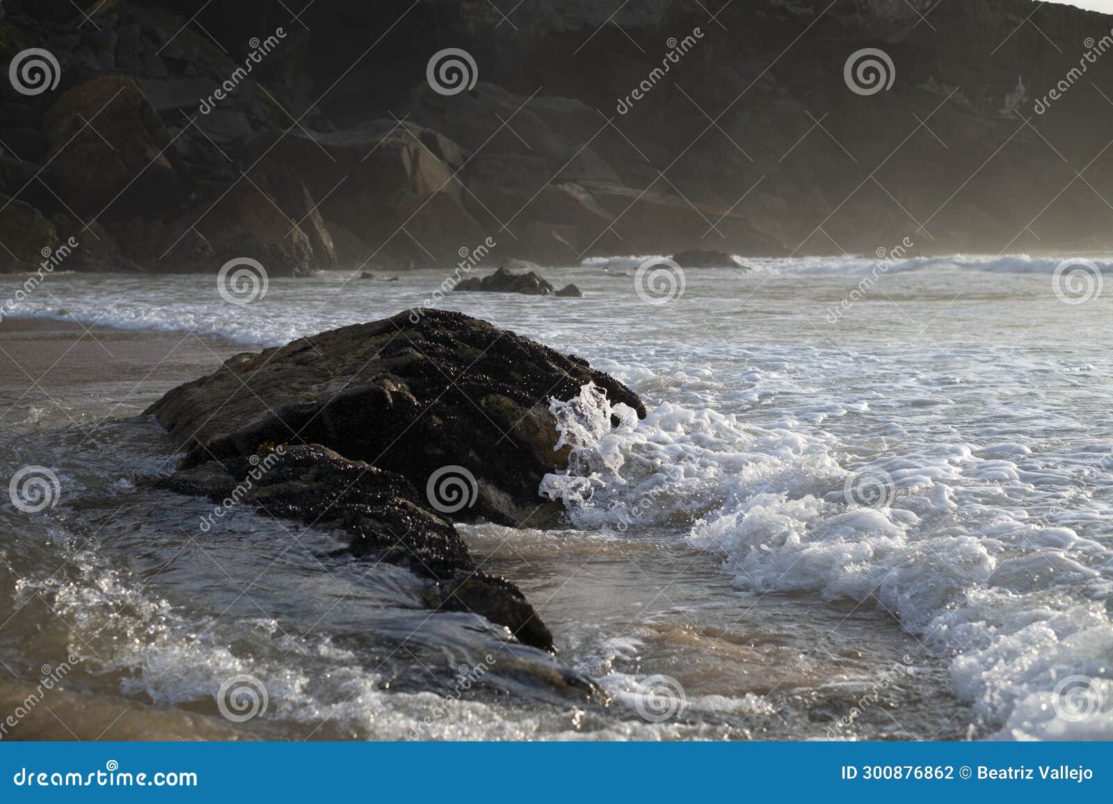 A wave crashing a rock stock photo. Image of outdoor - 300876862