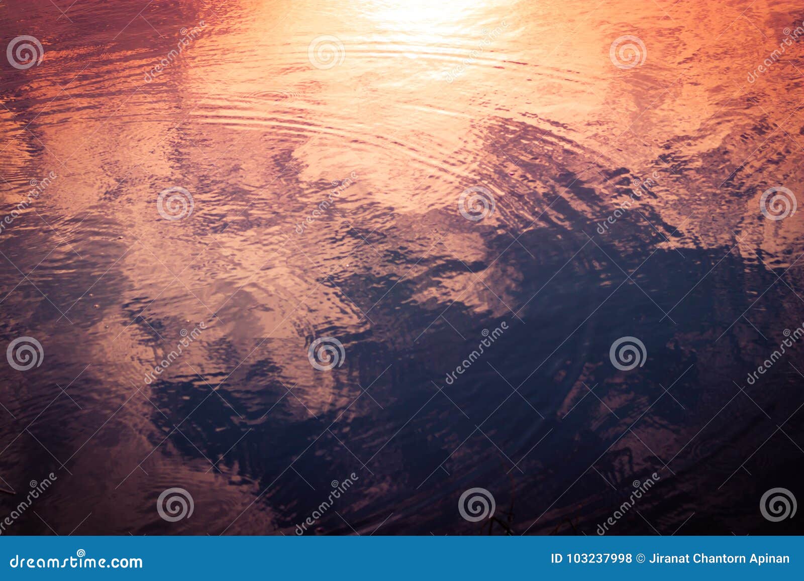 Wave in Dark Water with Reflection of Clouds and Sunset Stock Photo ...