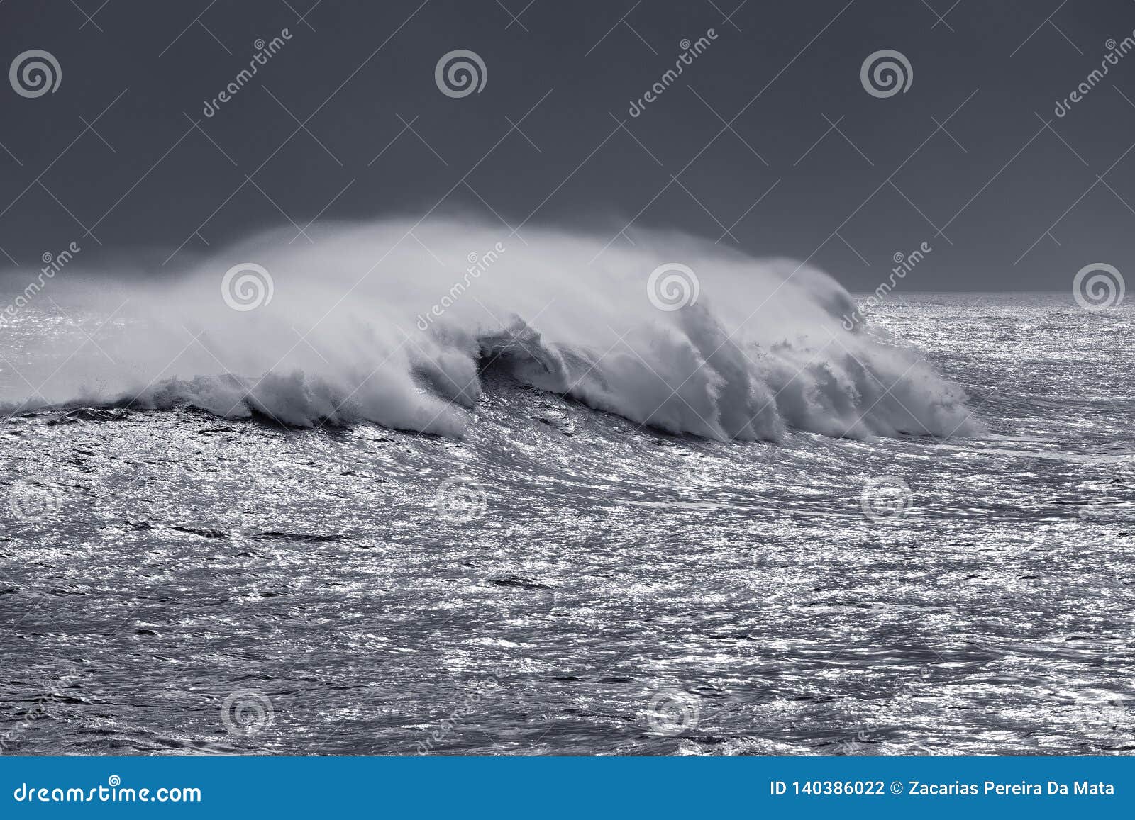 Wave in a glistening sea stock photo. Image of summer - 140386022