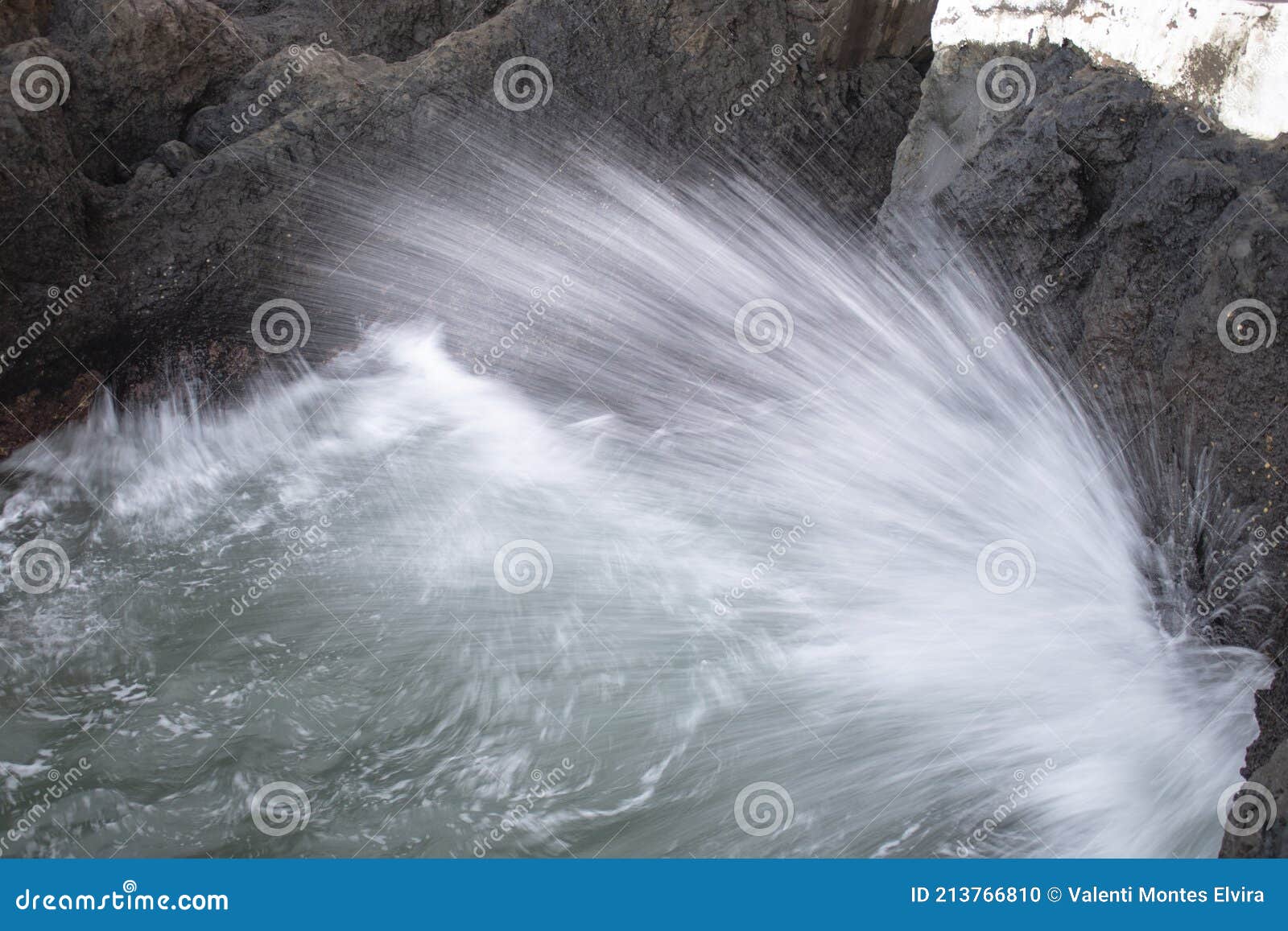Wave hitting a rock stock photo. Image of movement, daylight - 213766810