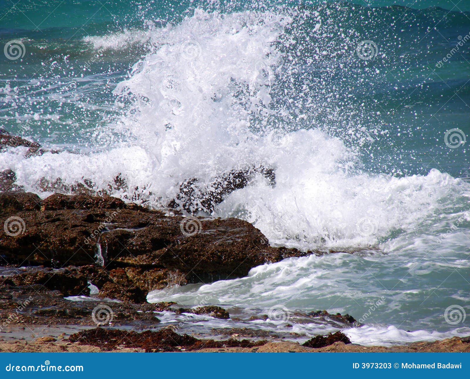 Wave hitting rocks stock image. Image of storm, pattern - 3973203