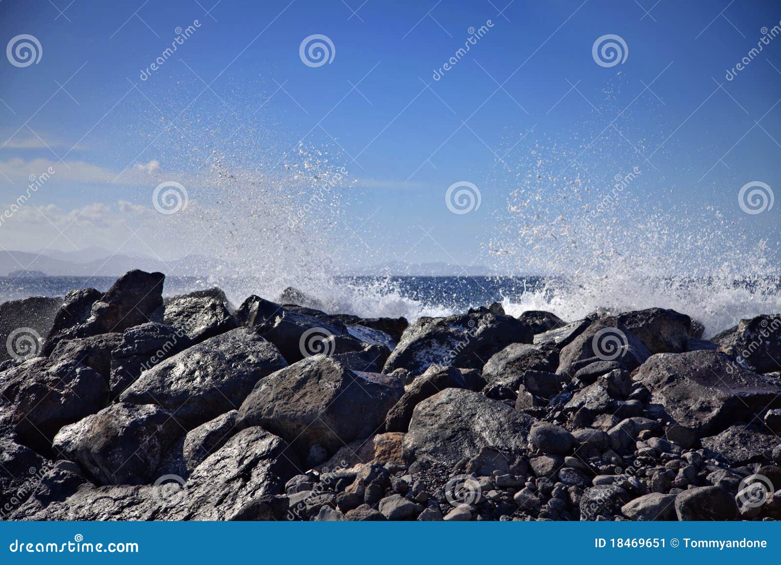 Wave Hitting Rocks with Blue Sky Stock Image - Image of white, stones ...