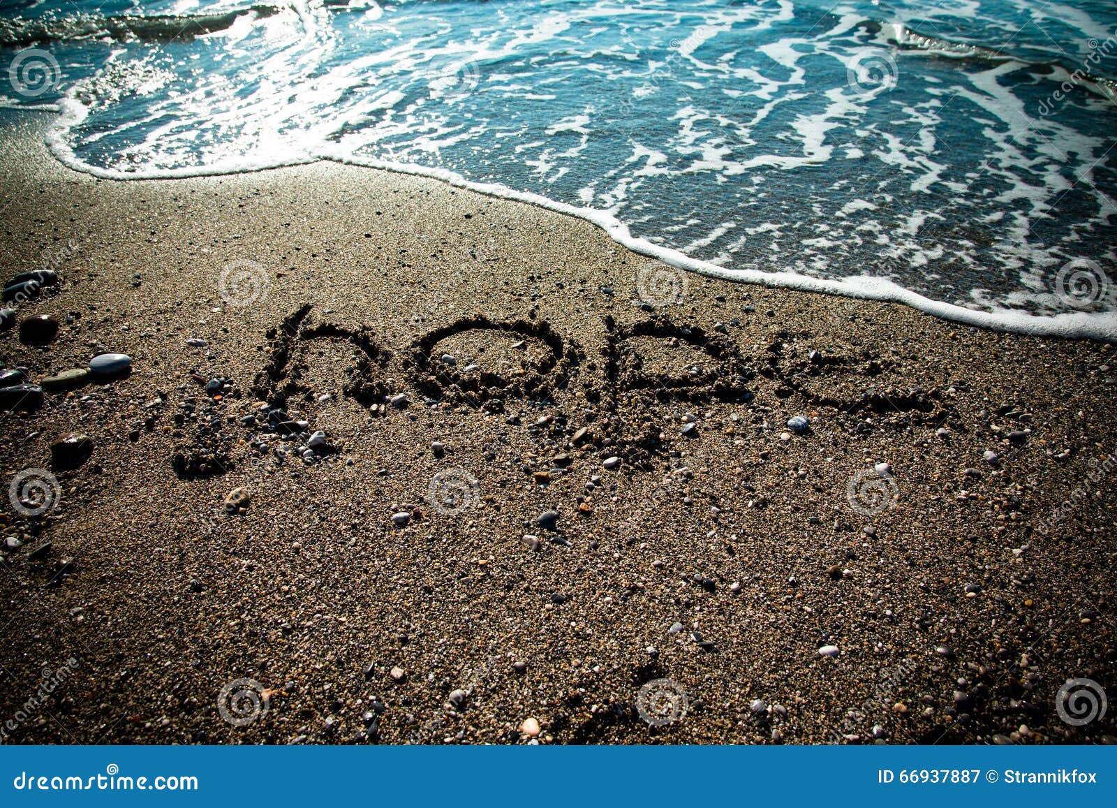 Wave and Inscription HOPE on the Pebble Coast of Sea. Selective Focus ...
