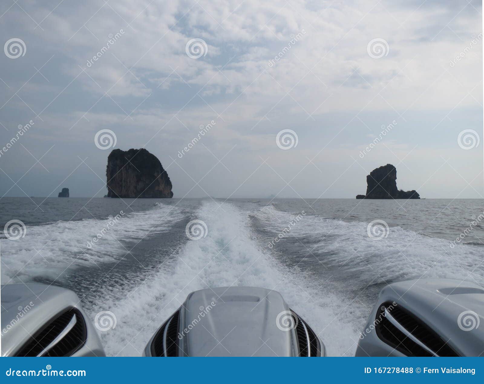 Wave and Islands Behind Speed Boat with Clouded Sky Stock Photo - Image ...