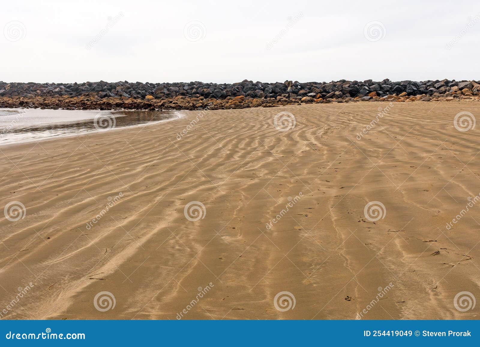Wave Patterns in the Sand stock image. Image of beach - 254419049
