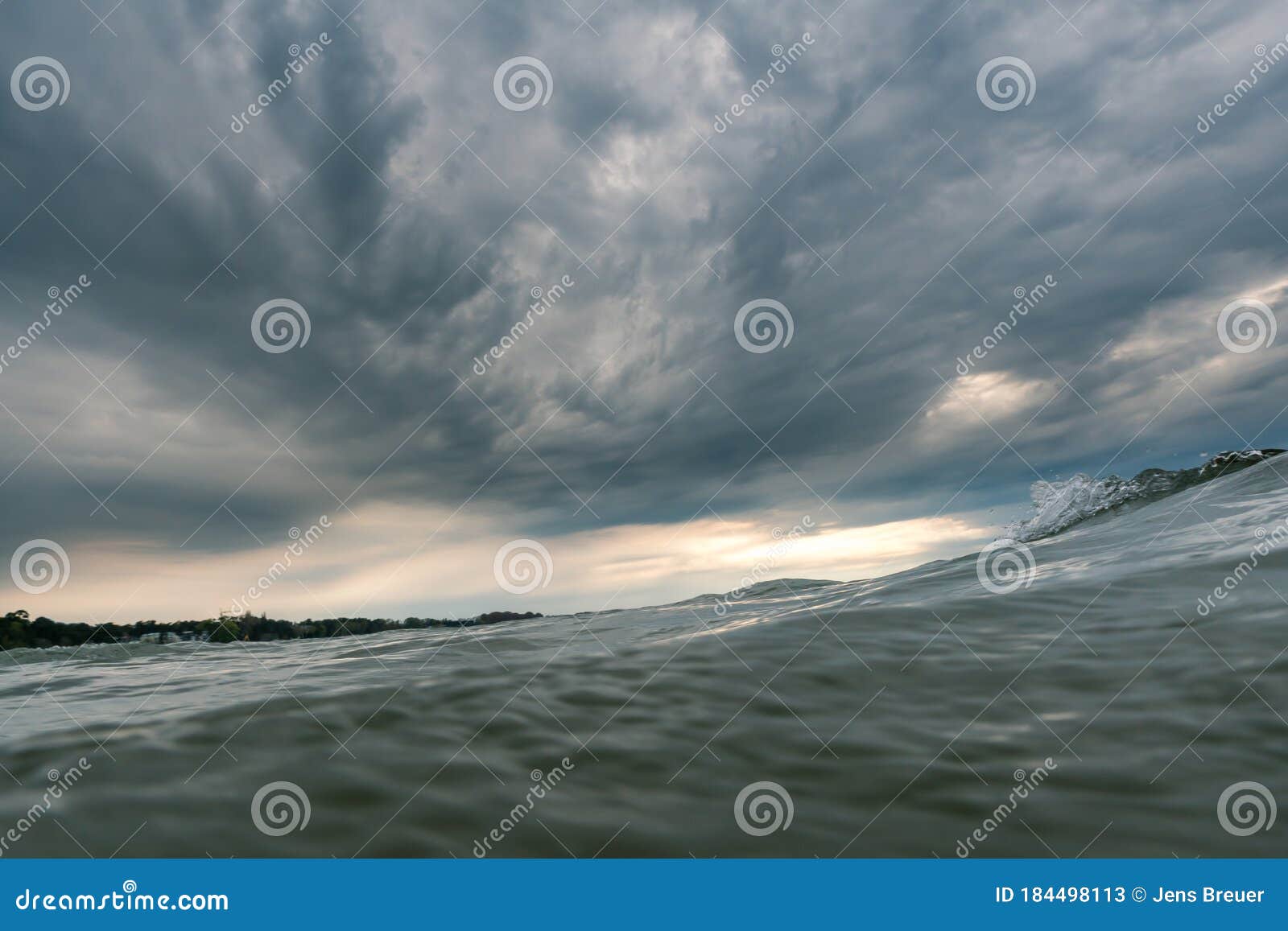 Wave Rolling in Photographed Low Angle from Side with Dramatic Sky ...