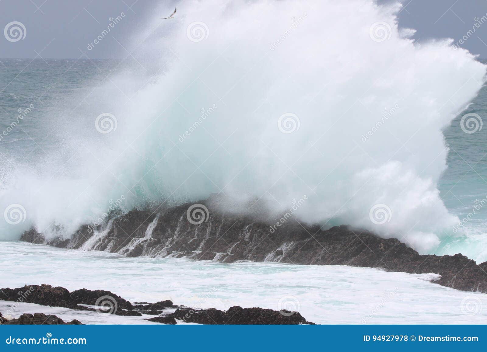 Wave slam against a rock stock photo. Image of beautiful - 94927978