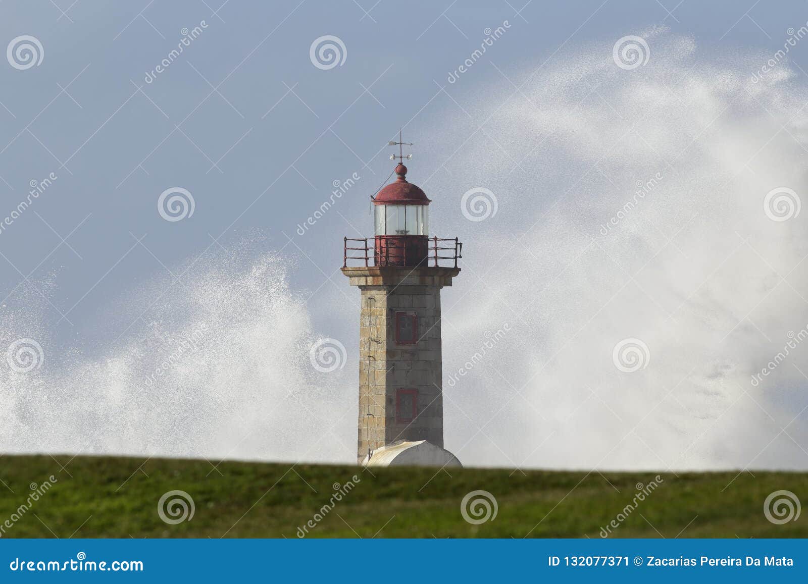 Wave Splash Over Lighthouse Stock Image - Image of power, weather ...