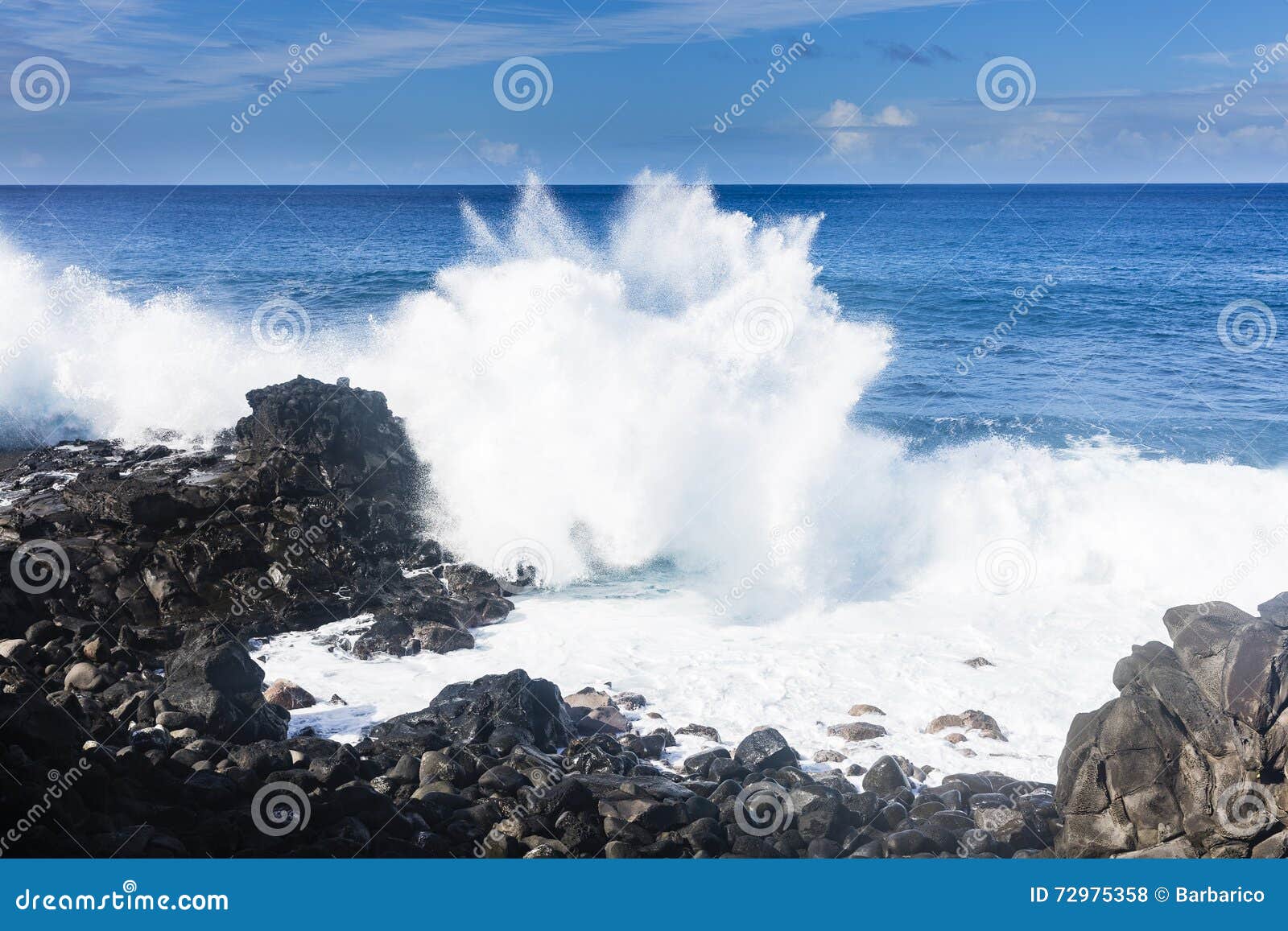 A Wave Splashing Against the Rocks Stock Photo - Image of geographic ...