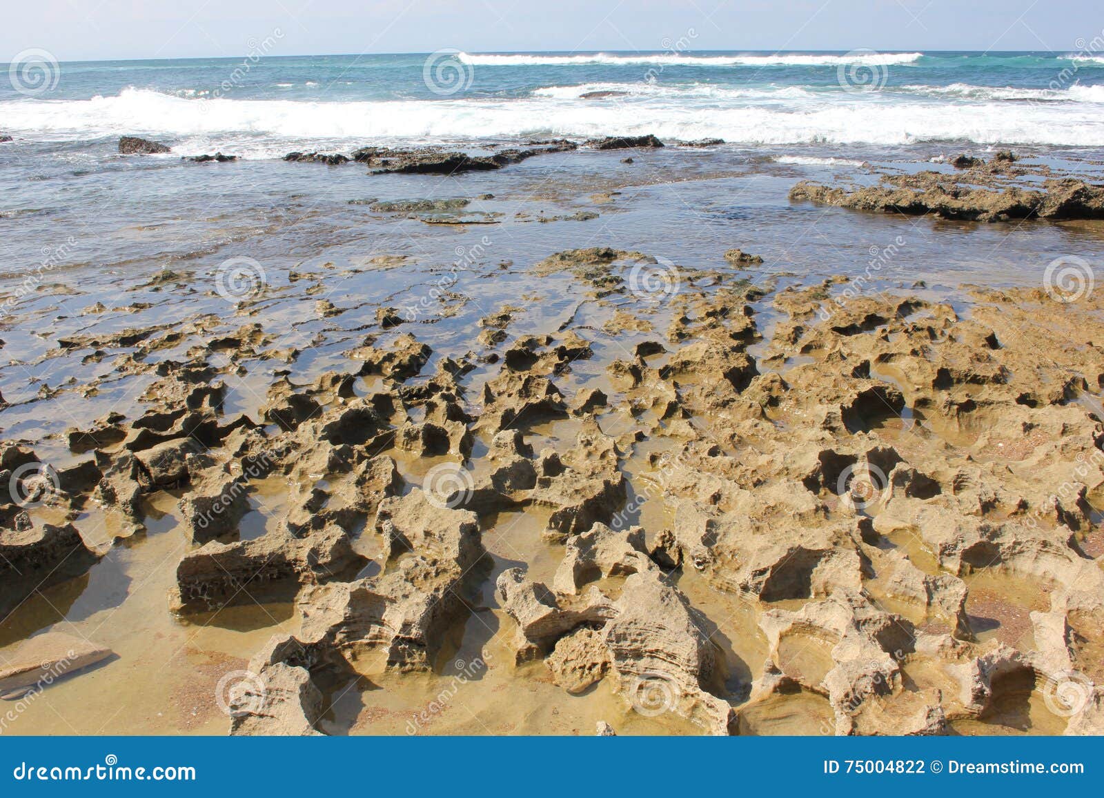 Waves and beach stock photo. Image of pitted, sand, eroding - 75004822